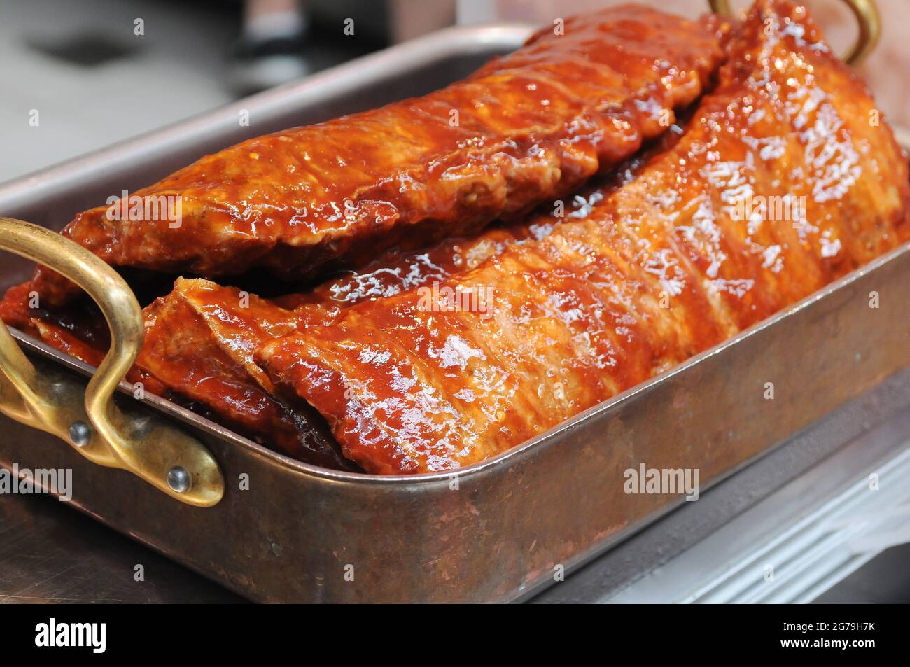 Copenhagen, Denmark. 12July 2021,Butcher prepares pork for brbecuse in ...