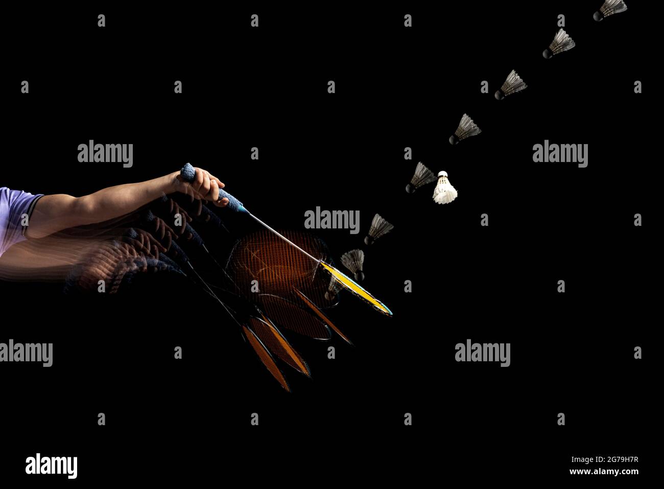 Close-up male hands with badminton racket and shuttlecock isolated over ...