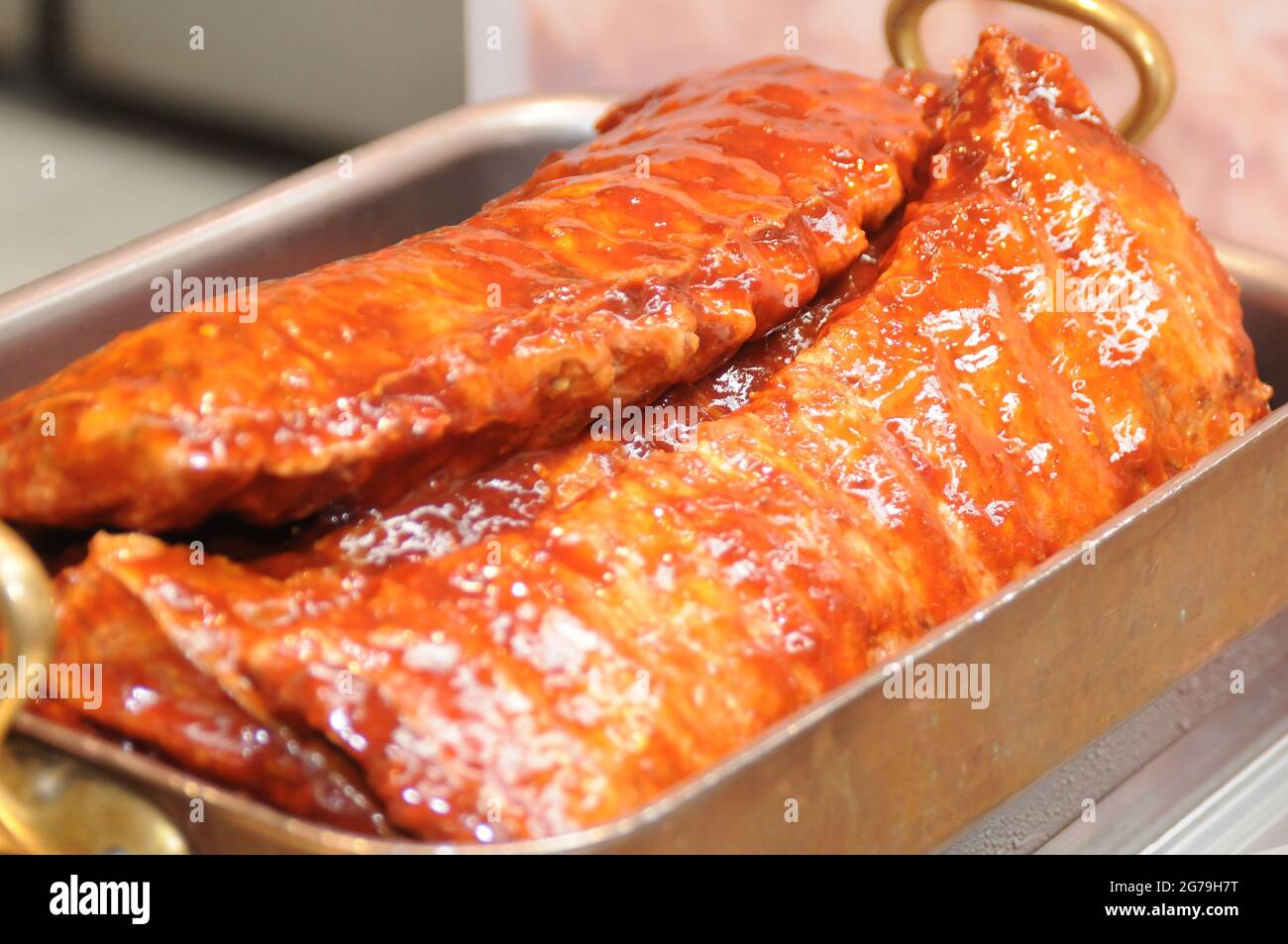 Copenhagen, Denmark. 12July 2021,Butcher prepares pork for brbecuse in ...