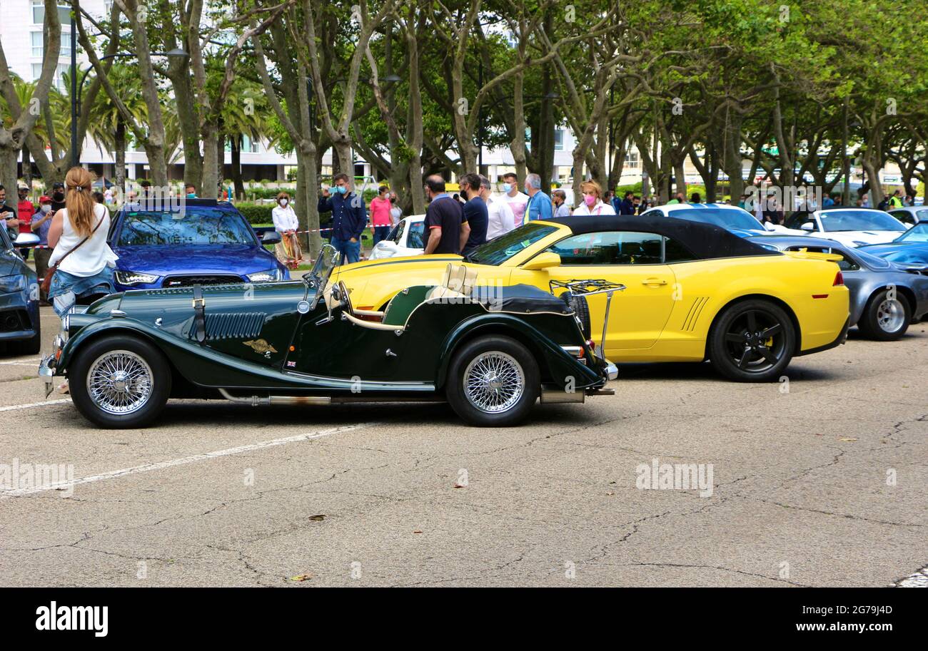 British racing green Morgan Plus Four car parked on display at a Super ...