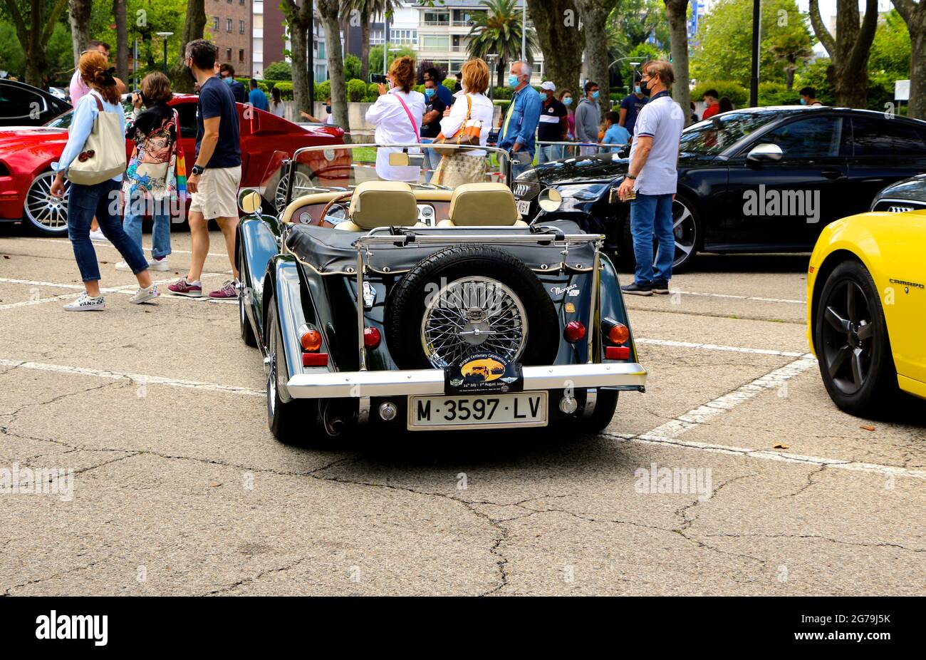 British racing green Morgan Plus Four car parked on display at a Super ...