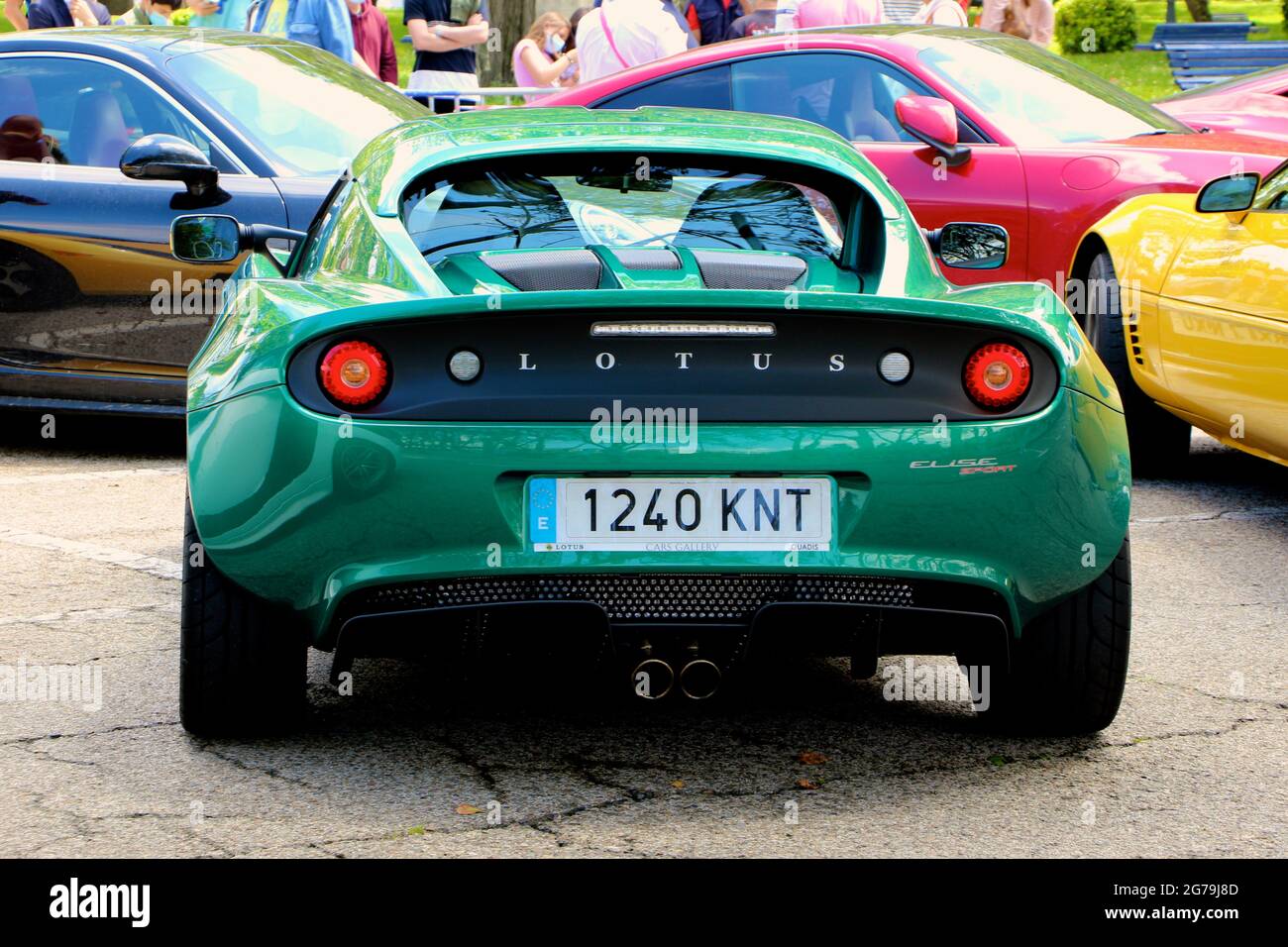 Rear view of a dark green hardtop Lotus Elise car parked at a Super car ...