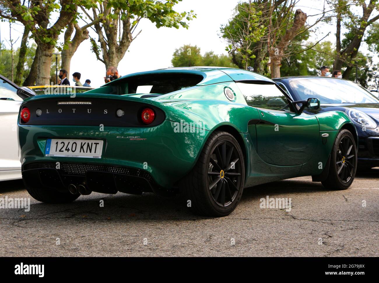 Rear view of a dark green hardtop Lotus Elise car parked at a Super car ...