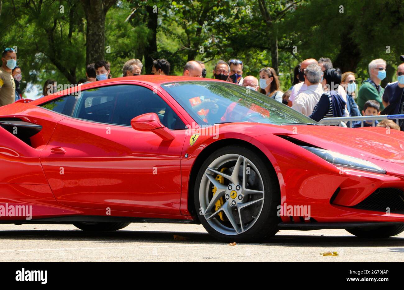 Cropped side view of a red Ferrari F8 Tributo car parked at a Super car ...