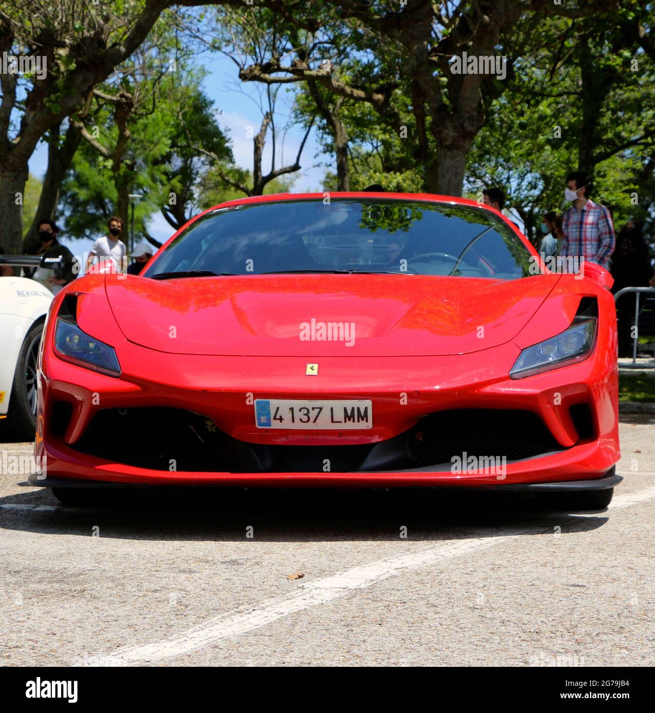 Front view of a red Ferrari F8 Tributo car parked at a Super car day ...