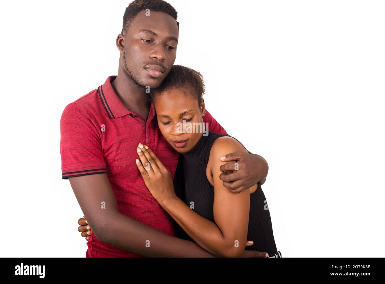 young man standing to console his sad girlfriend Stock Photo - Alamy
