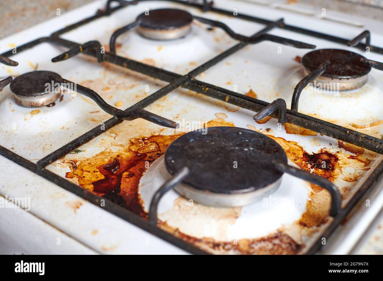 Dirty stove with food leftovers. Unclean gas kitchen cooktop with ...