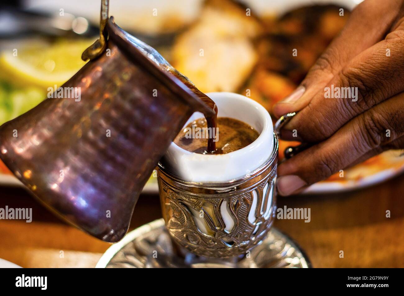 Pouring Turkish Coffee into Traditional Embossed Metal Cup Stock Photo ...
