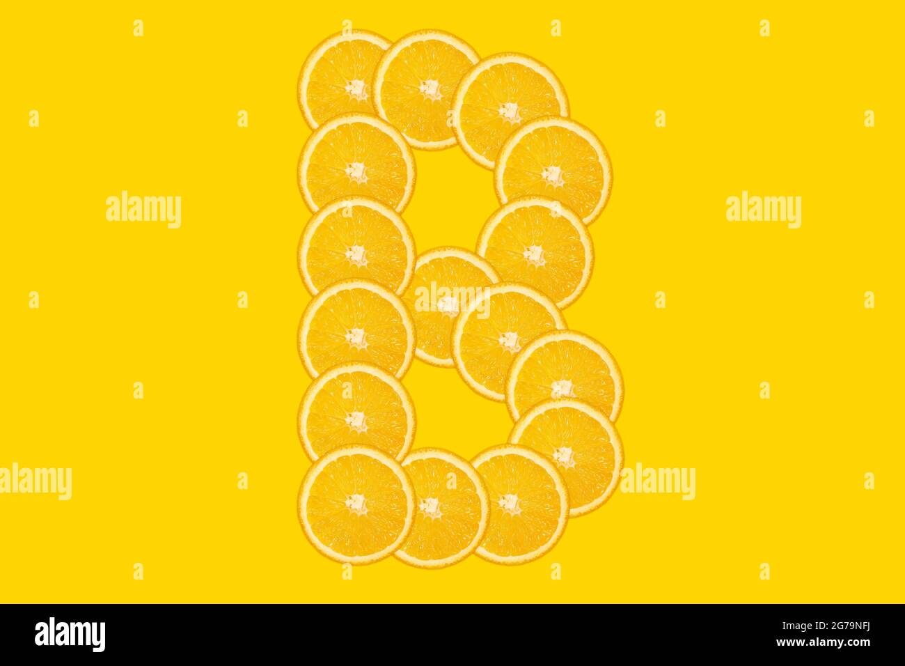 Sliced orange alphabet - letter B. Yellow background. Fresh healthy ...