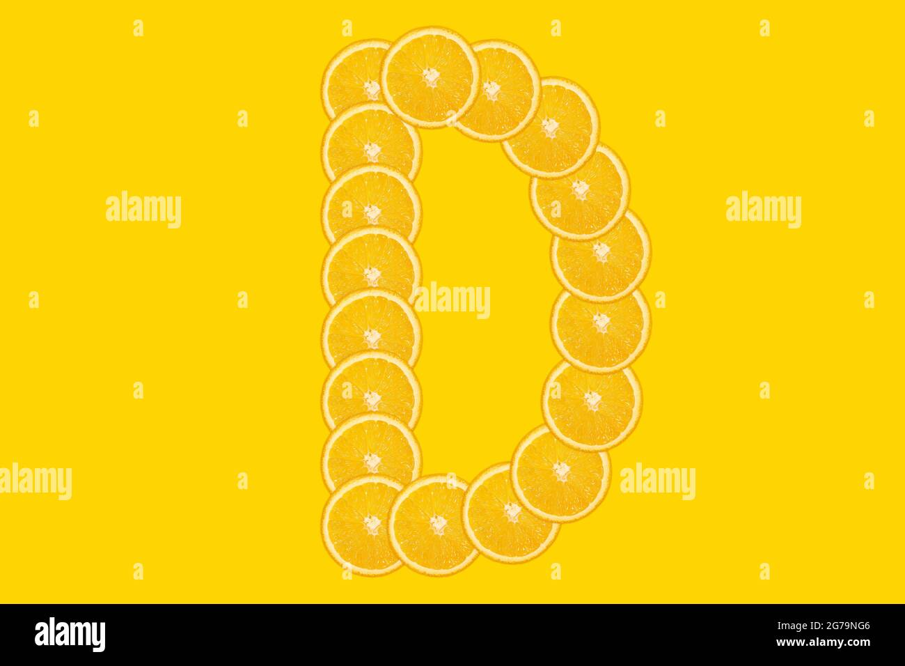 Sliced orange alphabet - letter D. Yellow background. Fresh healthy ...