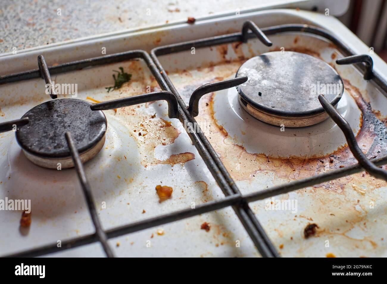 Dirty stove with food leftovers. Unclean gas kitchen cooktop with ...