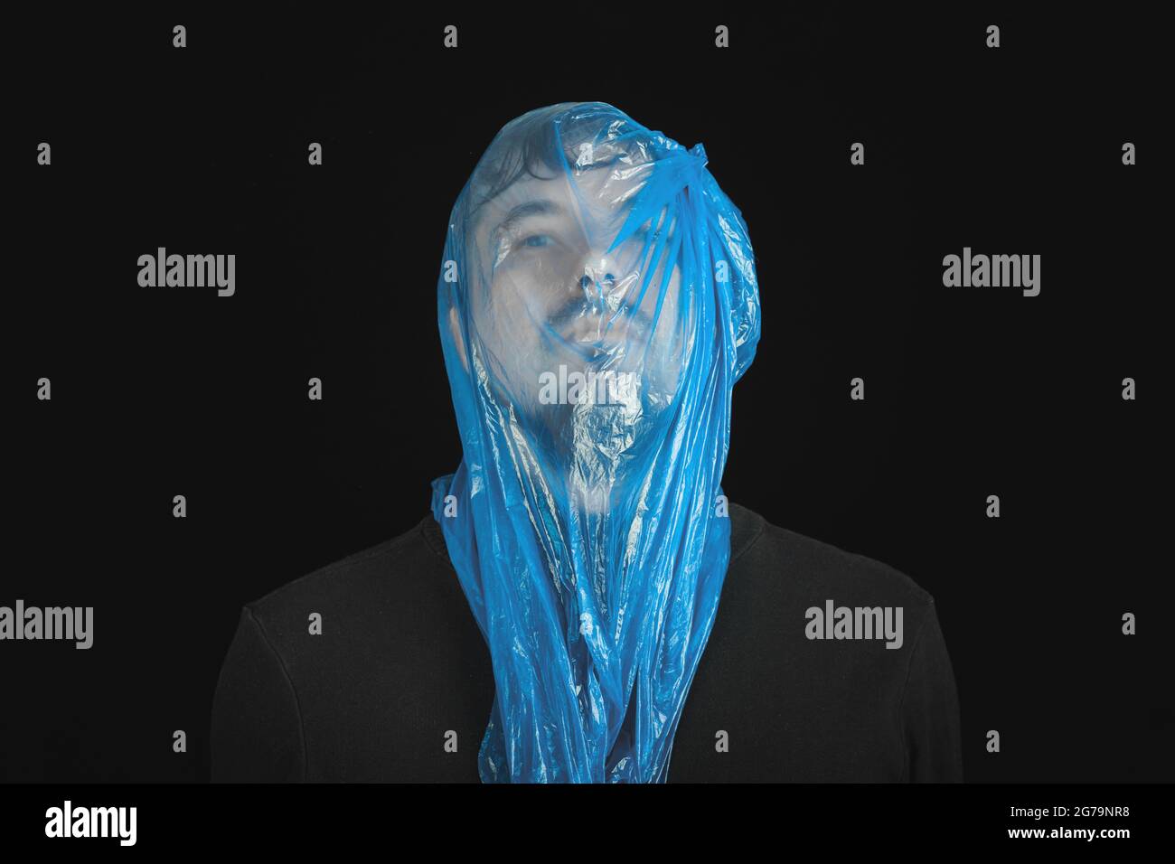 Blue garbage bag on man head. Exit bag for suicide. Self-asphyxiation ...