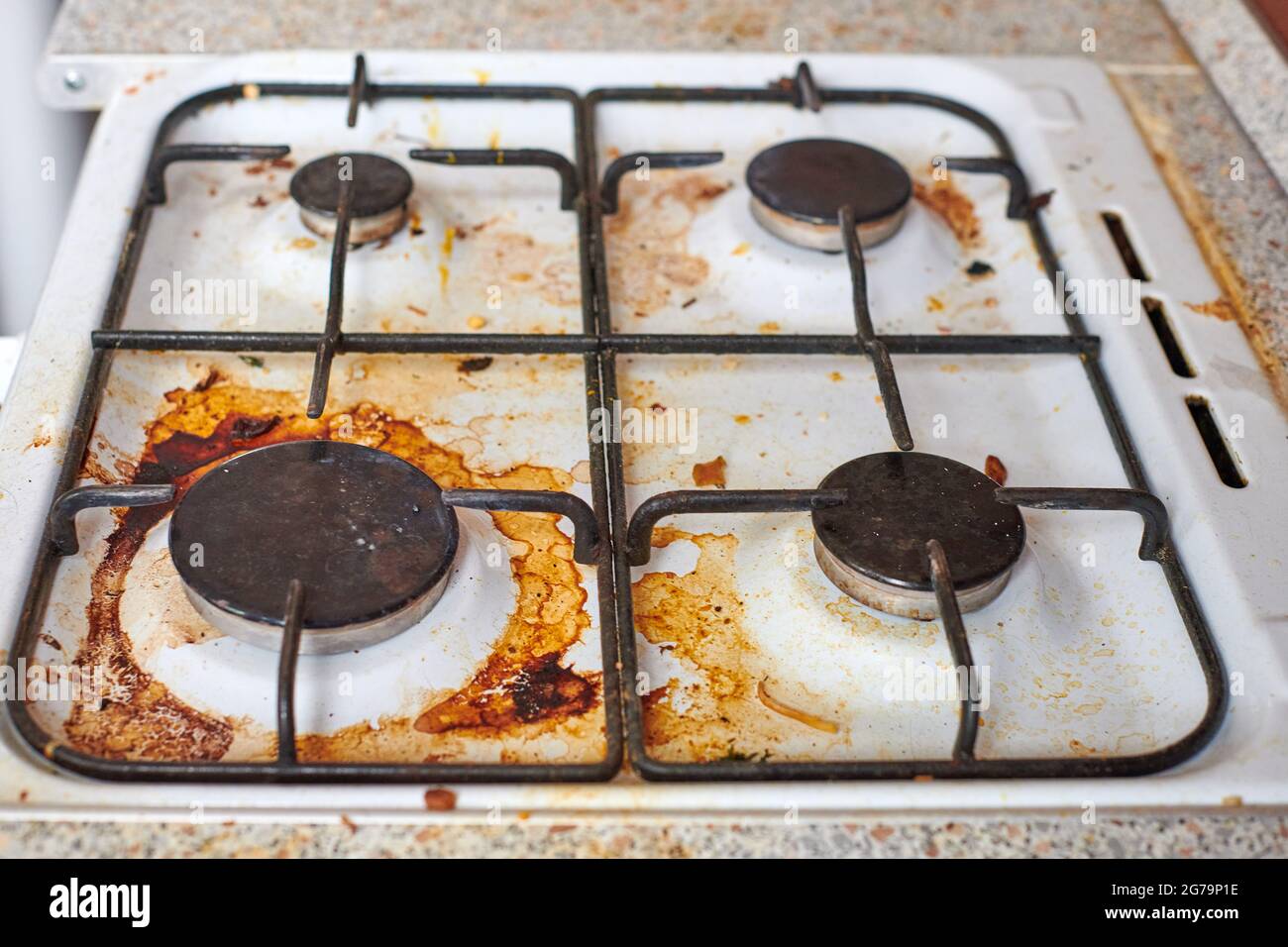 Dirty grease stove with food leftovers. Unclean gas kitchen cooktop ...