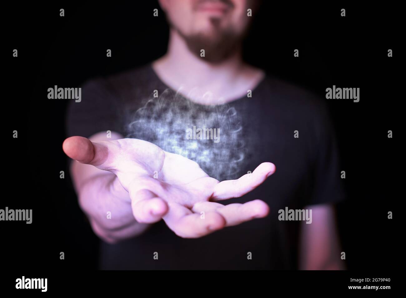 Energy ball in wizard hand. Bearded man casting bright magic ball spell ...