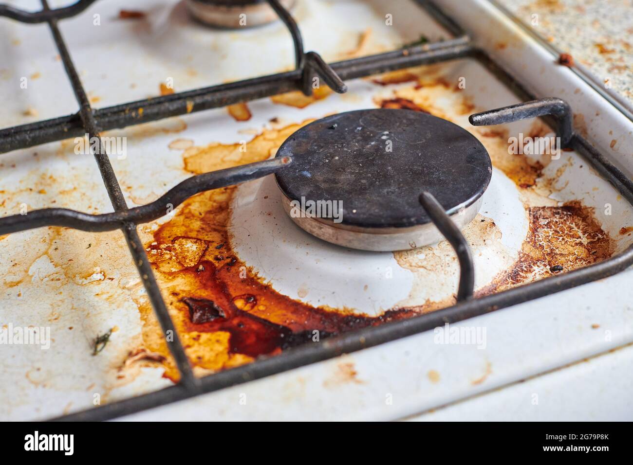 Dirty stove with food leftovers. Unclean gas kitchen cooktop with ...