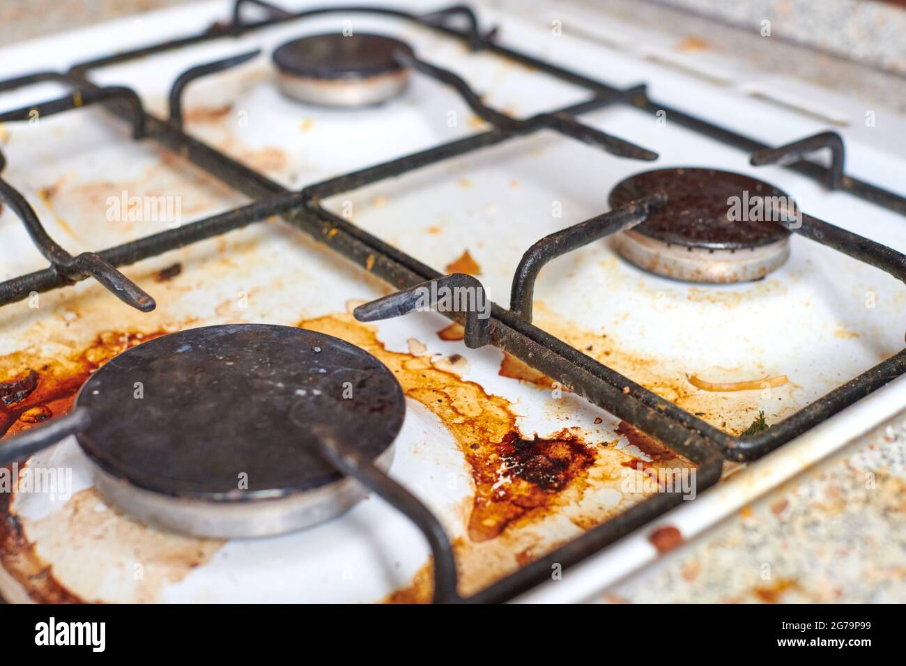 Dirty grease stove with food leftovers. Unclean gas kitchen cooktop ...