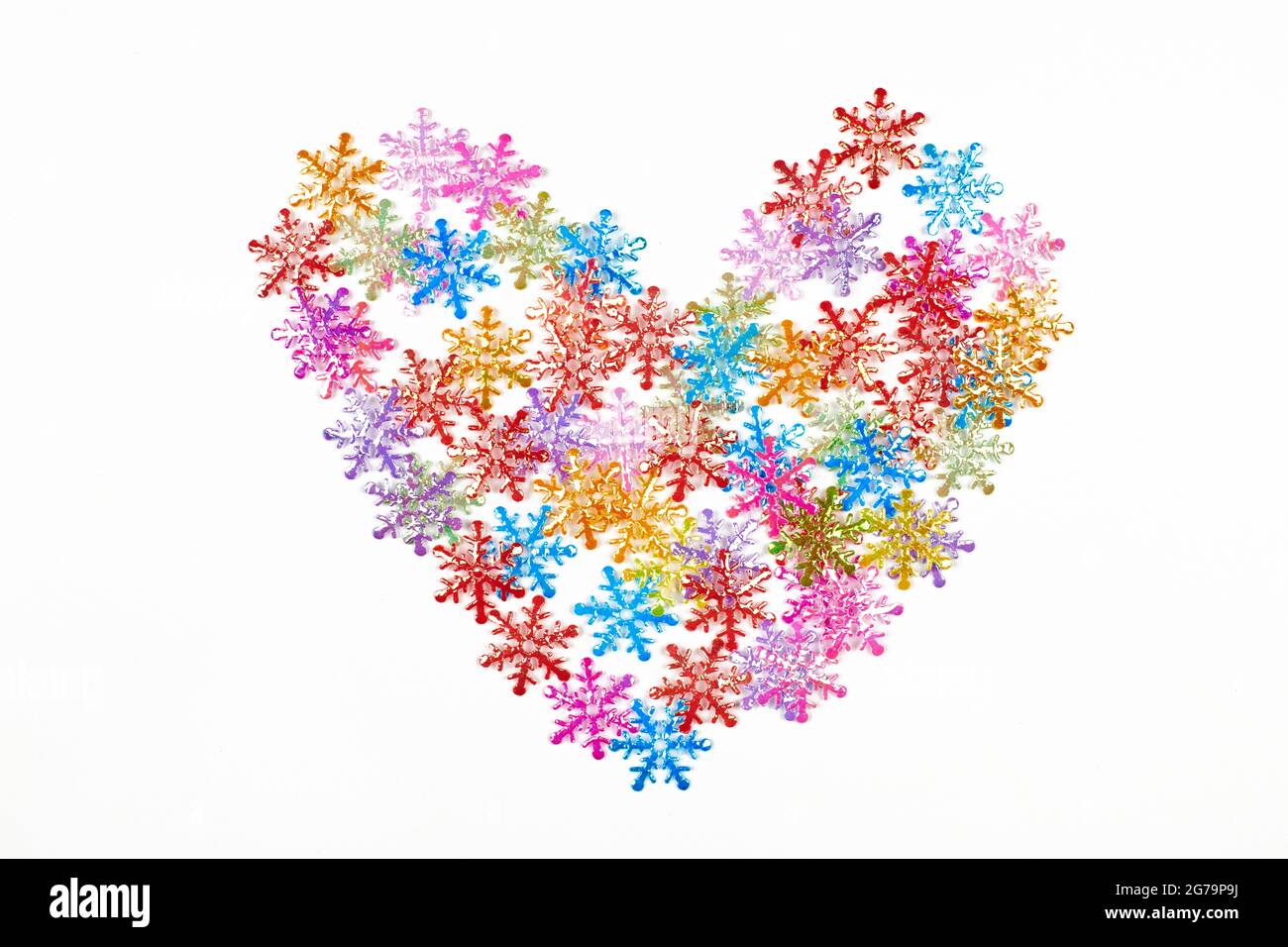 Heart shape from colorful snowflakes, isolated white background. Love ...