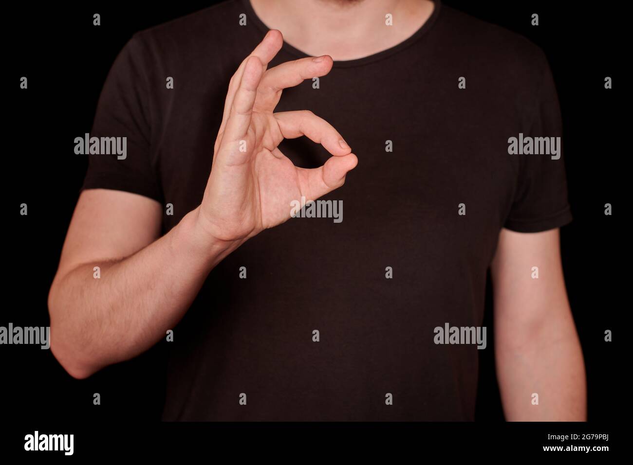 OK signal man hand gesture. Okay sign, black background. Positive sign ...