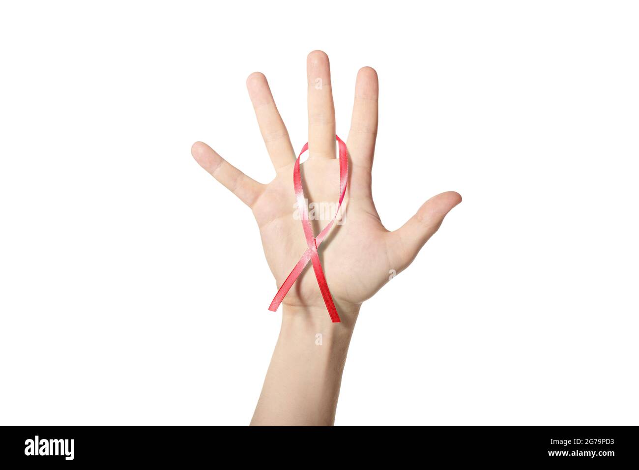 Red awareness ribbon in hand. Symbol of HIV AIDS, substance abuse or ...