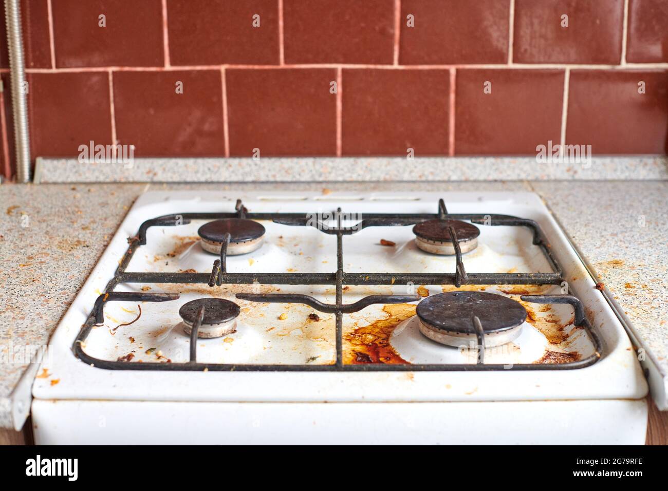 Dirty stove with food leftovers. Unclean gas kitchen cooktop with ...