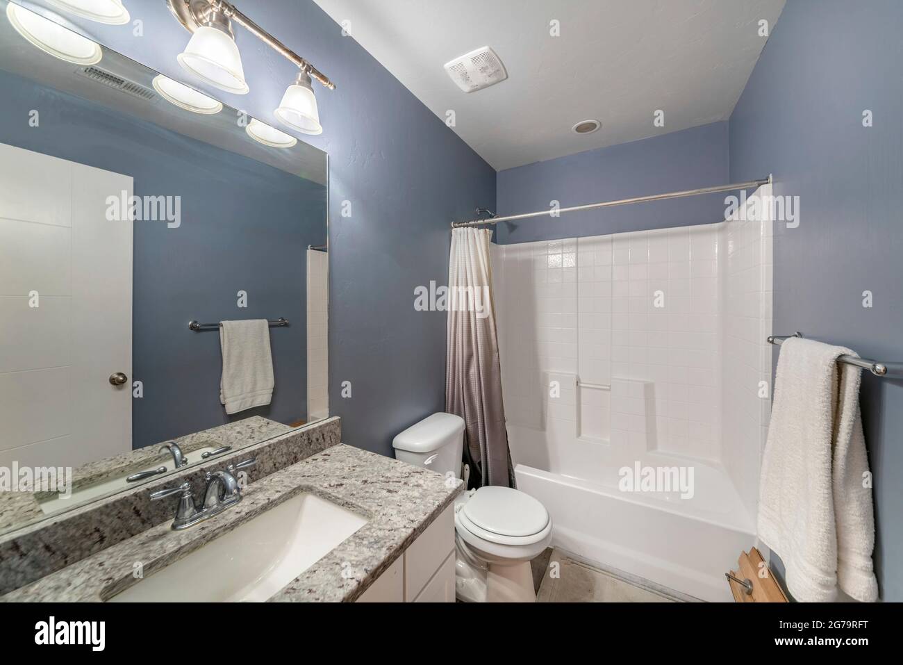 Bathroom interior with lights and purple gray wall paint Stock Photo ...