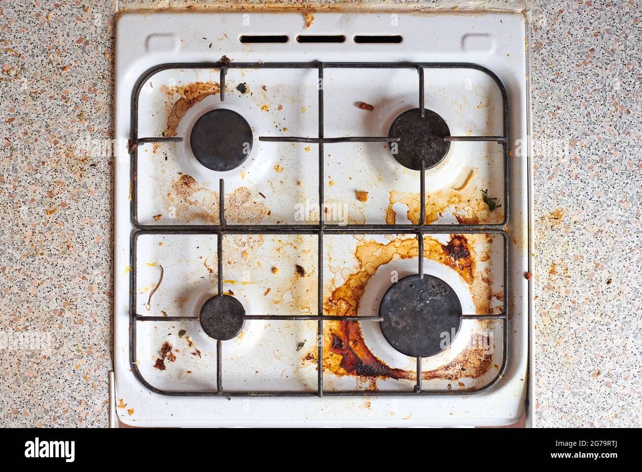 Dirty grease stove with food leftovers. Unclean gas kitchen cooktop ...