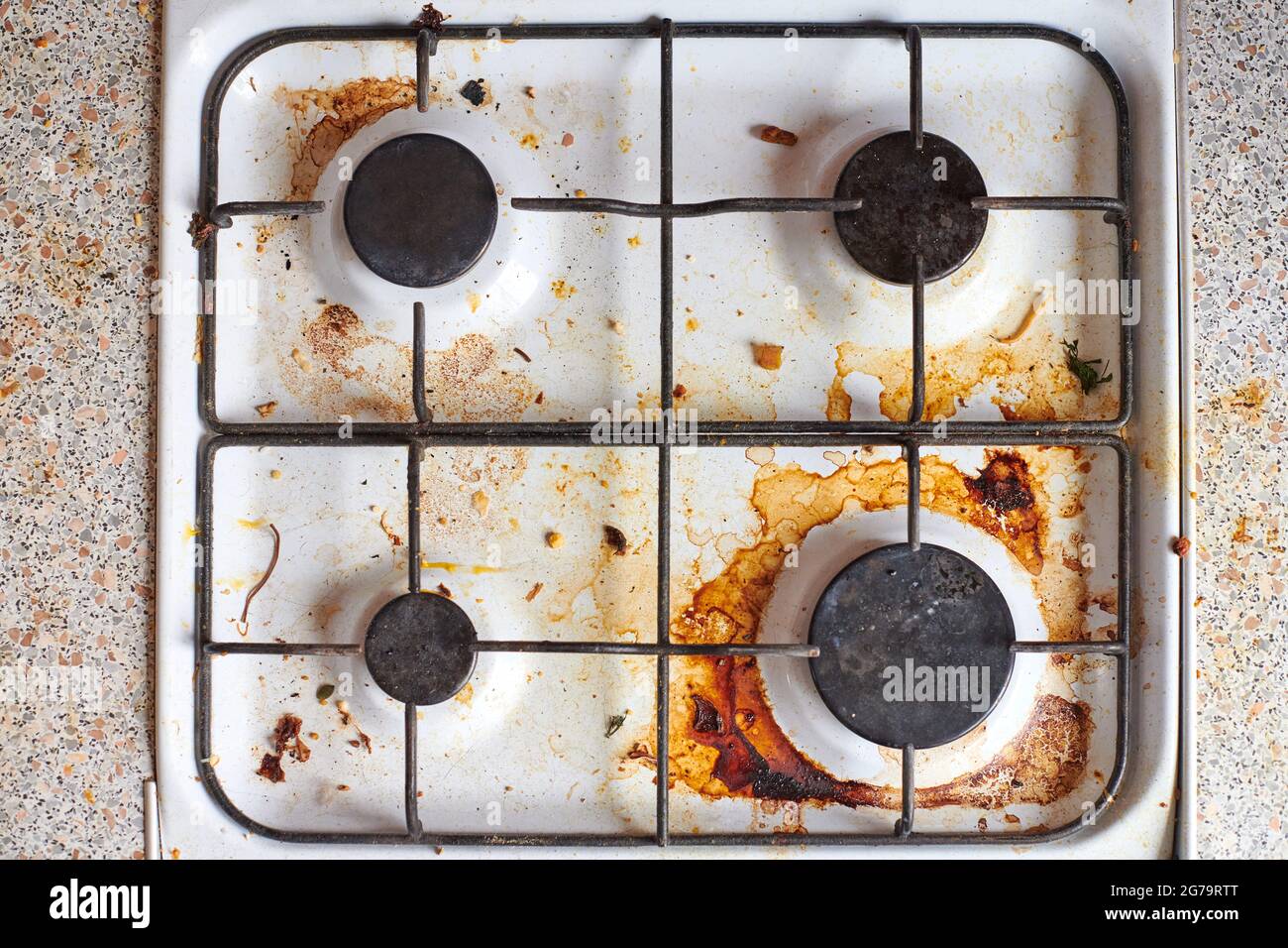 Dirty stove with food leftovers. Unclean gas kitchen cooktop with ...