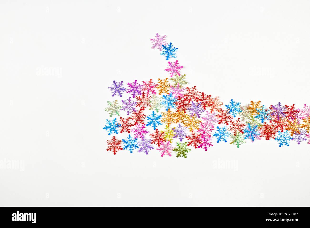 Thumbs up like gesture from colorful snowflakes, isolated white ...