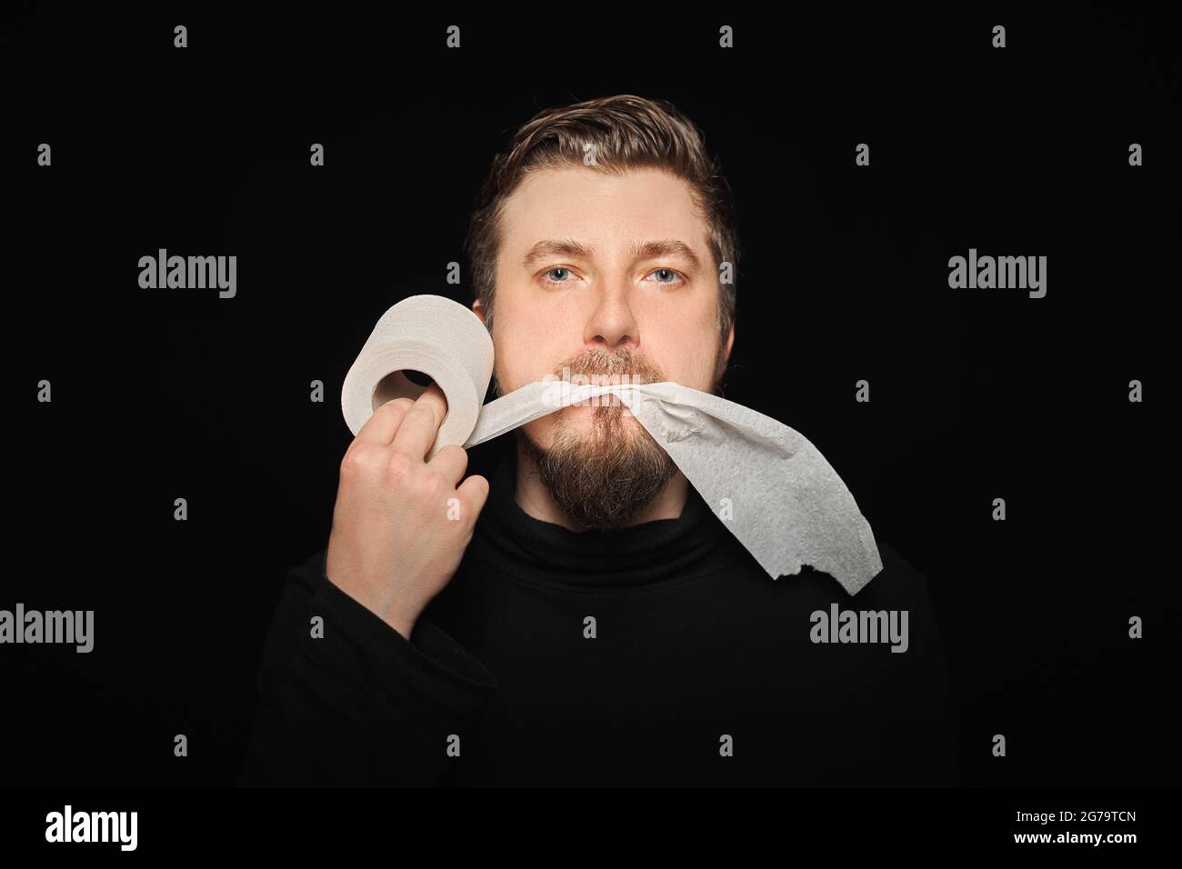 Man eating toilet paper. Funny hunger man, fasting concept. Hunger ...