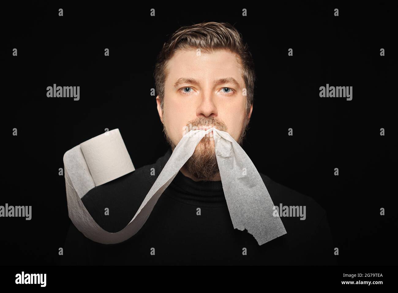 Man eating toilet paper. Funny hunger man, fasting concept. Hunger ...