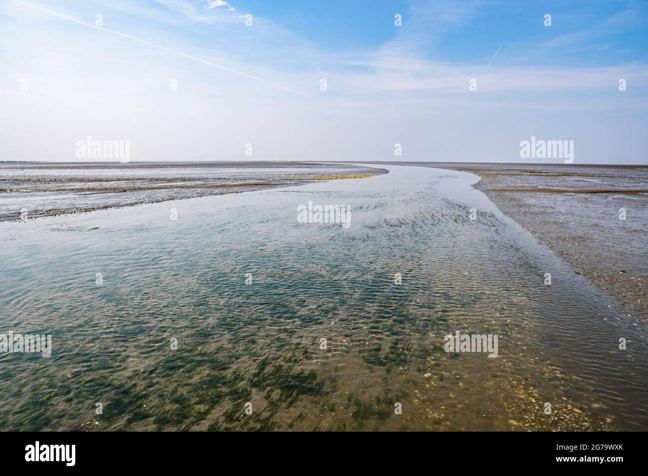 big river floating through the mudflat of the north sea at sahlenburg ...