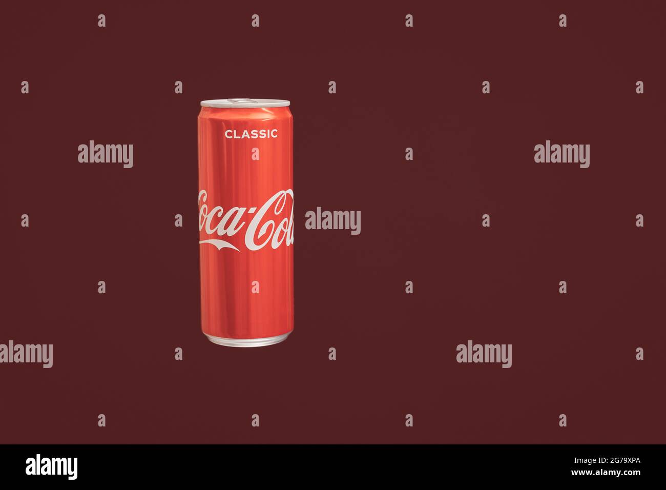 KALININGRAD, RUSSIA - MARCH 13, 2021 - Coca Cola can, red background ...