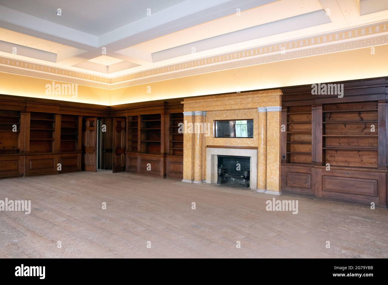 Belsay Hall interior library fireplace Stock Photo - Alamy