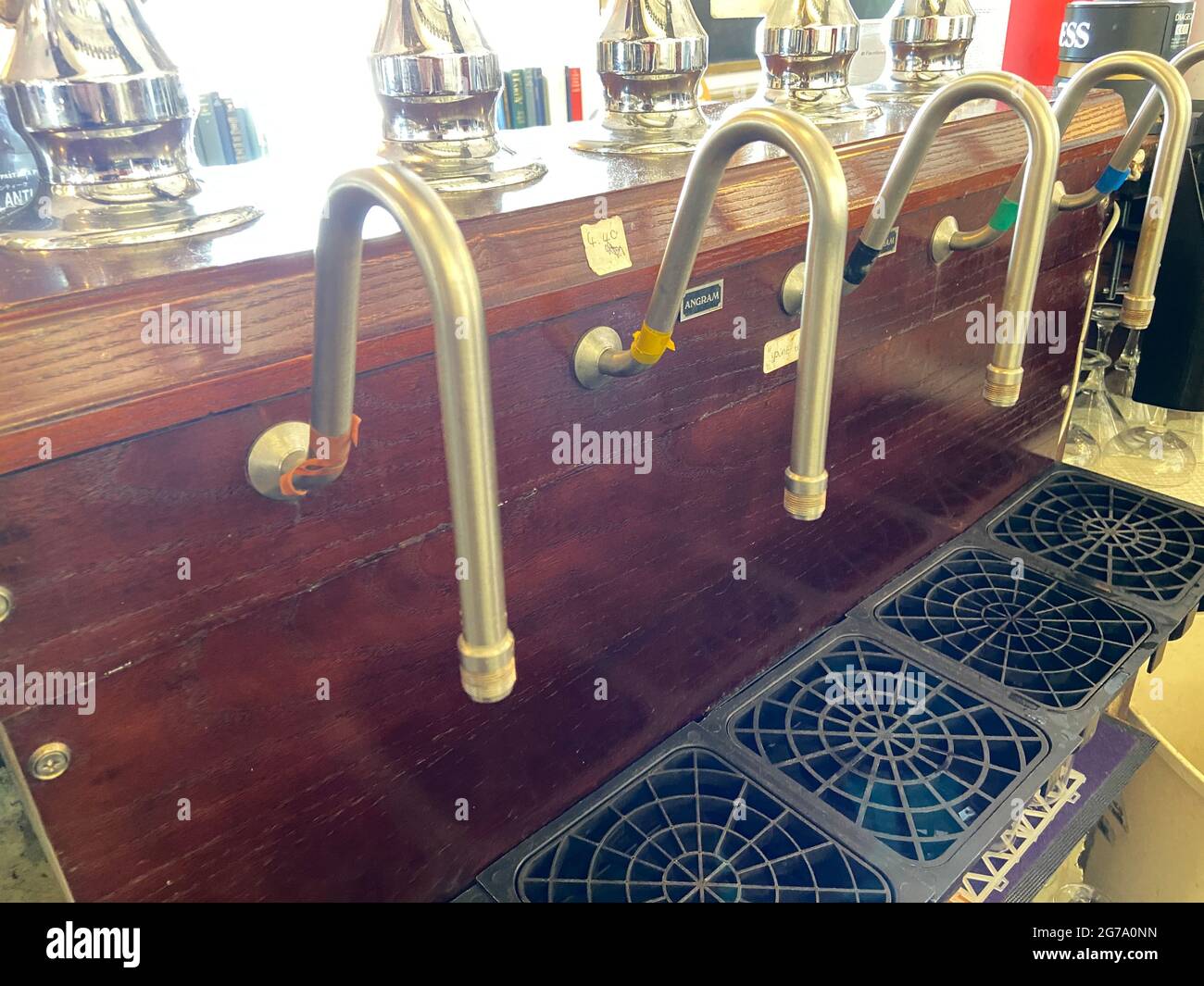 beer taps in pub bar with cleaning spray following covid-19 guidelines ...