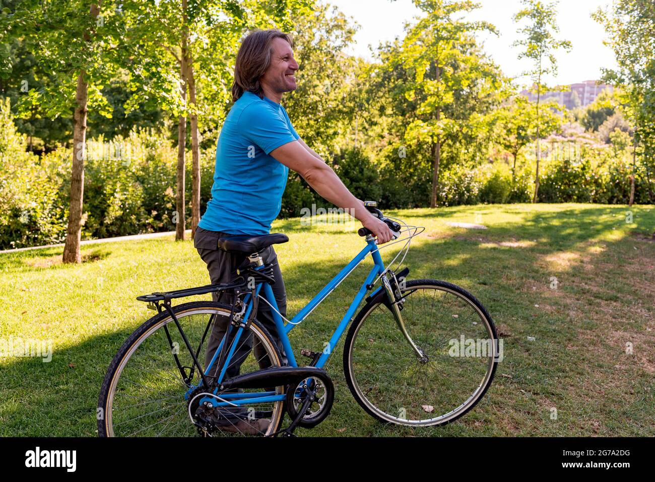 People exercising walking riding bike bicycle hi-res stock photography ...
