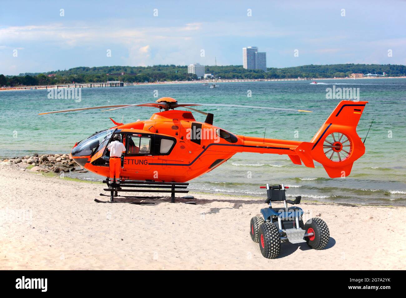 Rescue helicopter with beach wheelchair on timmendorfer strand hi-res ...
