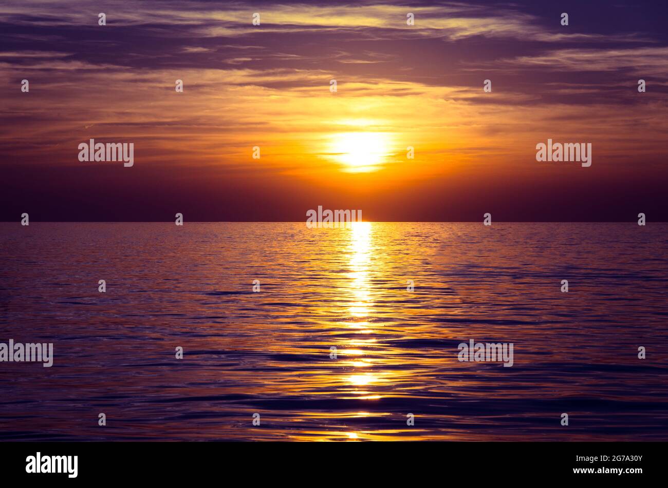Purple sunset reflection in water hi-res stock photography and images ...