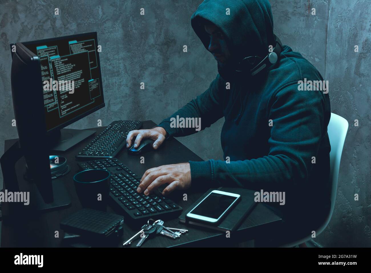 Hacker programmer using computer in dark room Stock Photo - Alamy