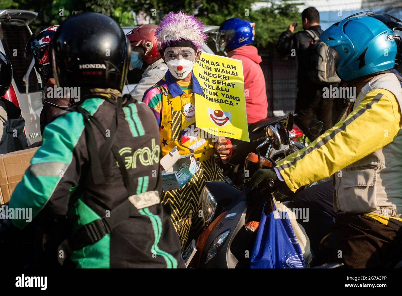 South Jakarta, Indonesia. 12th July, 2021. A member of Aku Badut ...