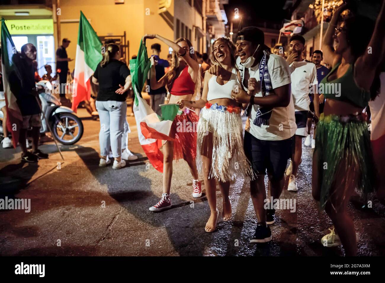 Tropea, Italy. 12th July, 2021. Jubilant Italian fans celebrate victory ...