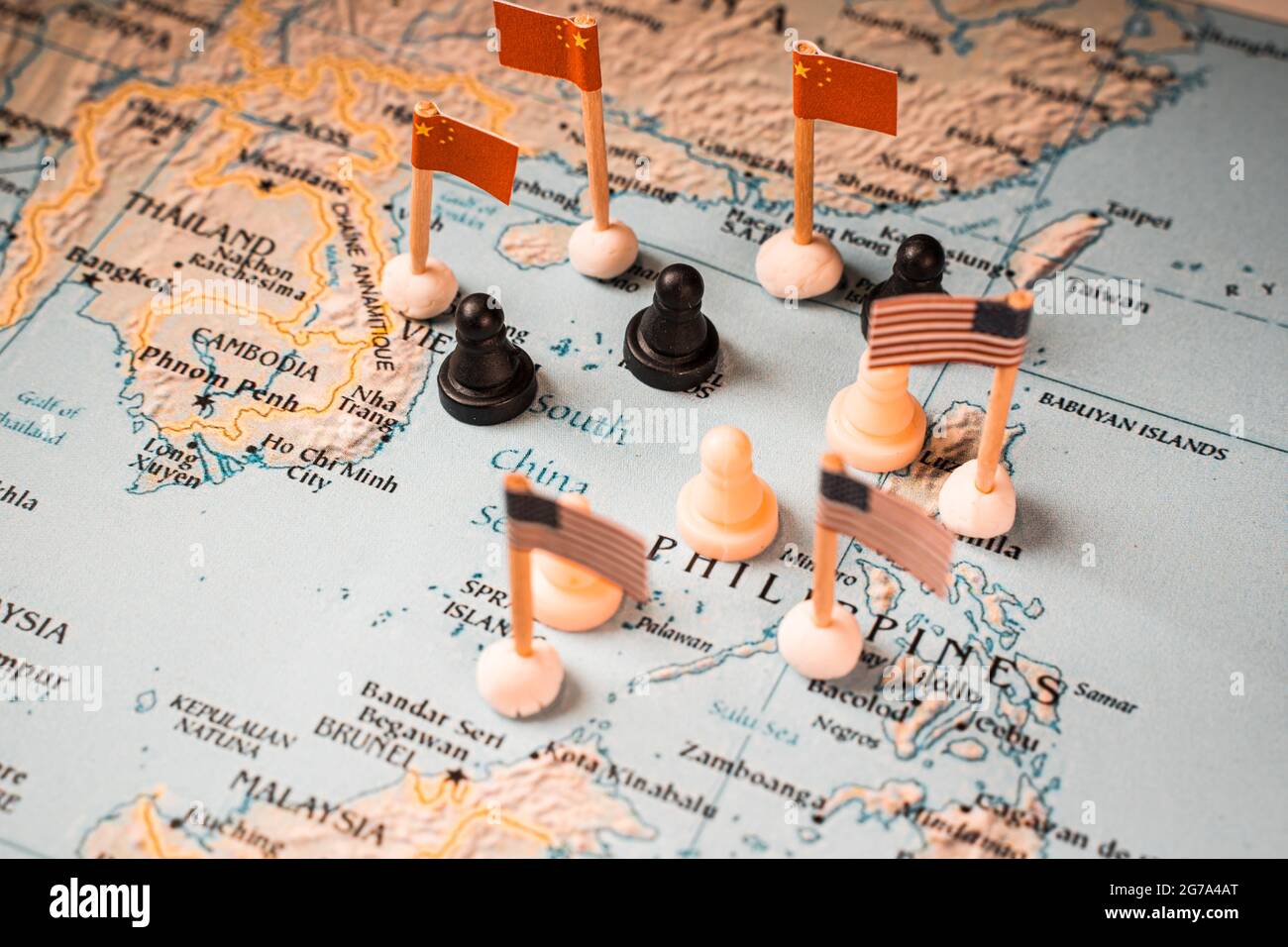 Chinese and U.S. flags with chess pieces symbolizing the conflict and ...