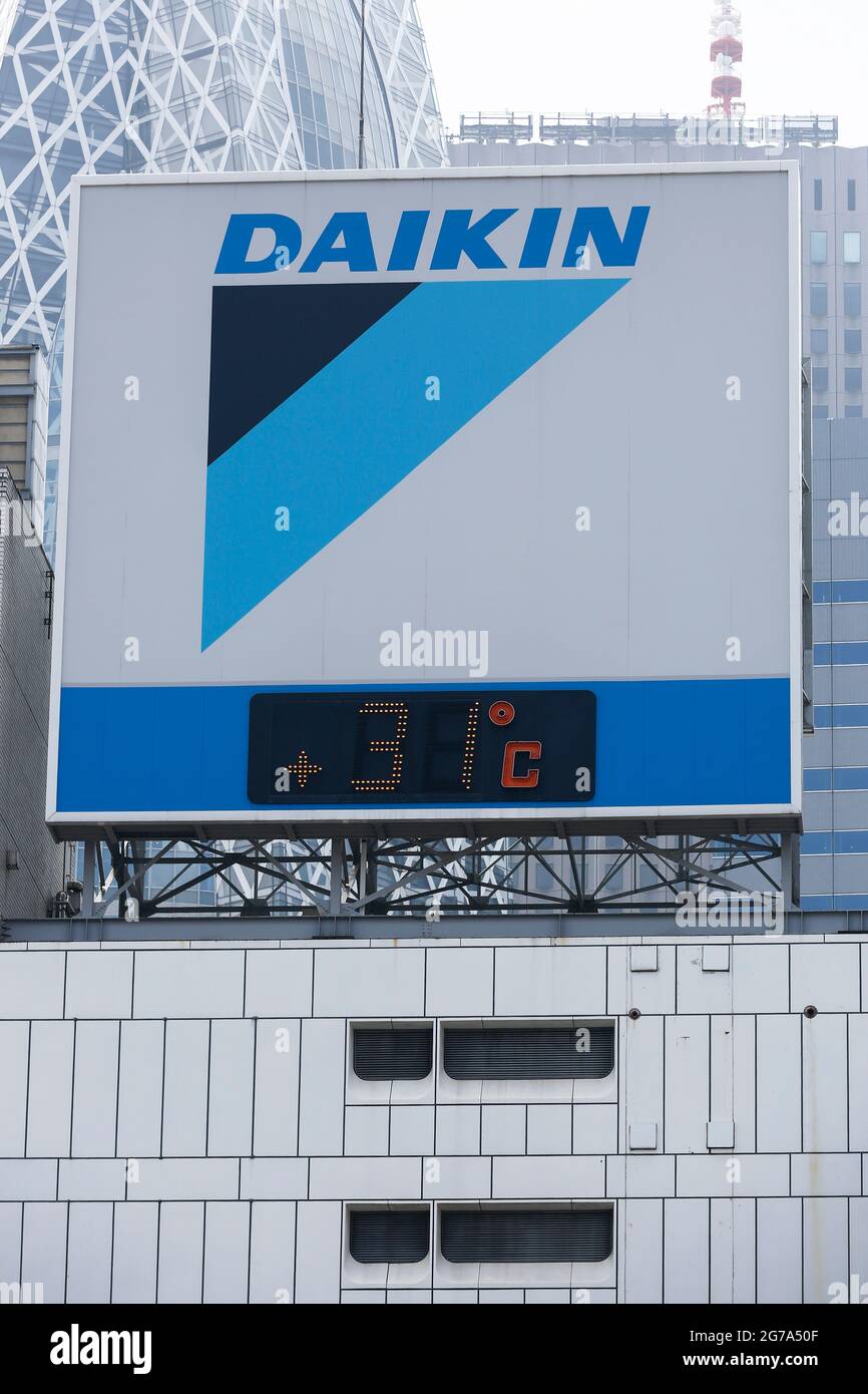A thermometer marks 31 C degrees in Shinjuku district on July 11, 2021 ...