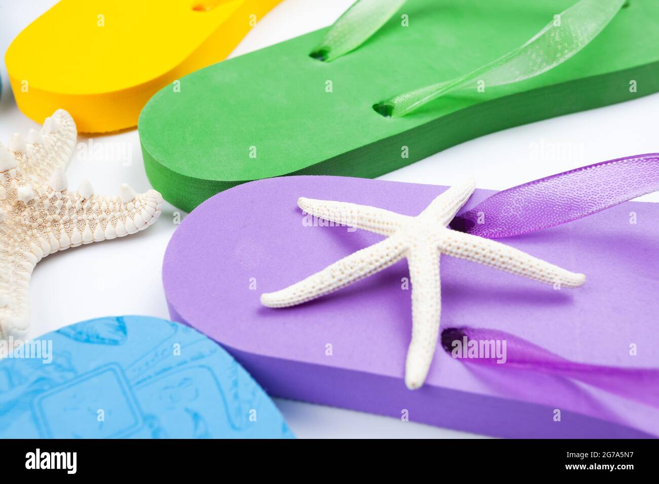A few rubber beach flop flops and starfish, use as a background Stock ...