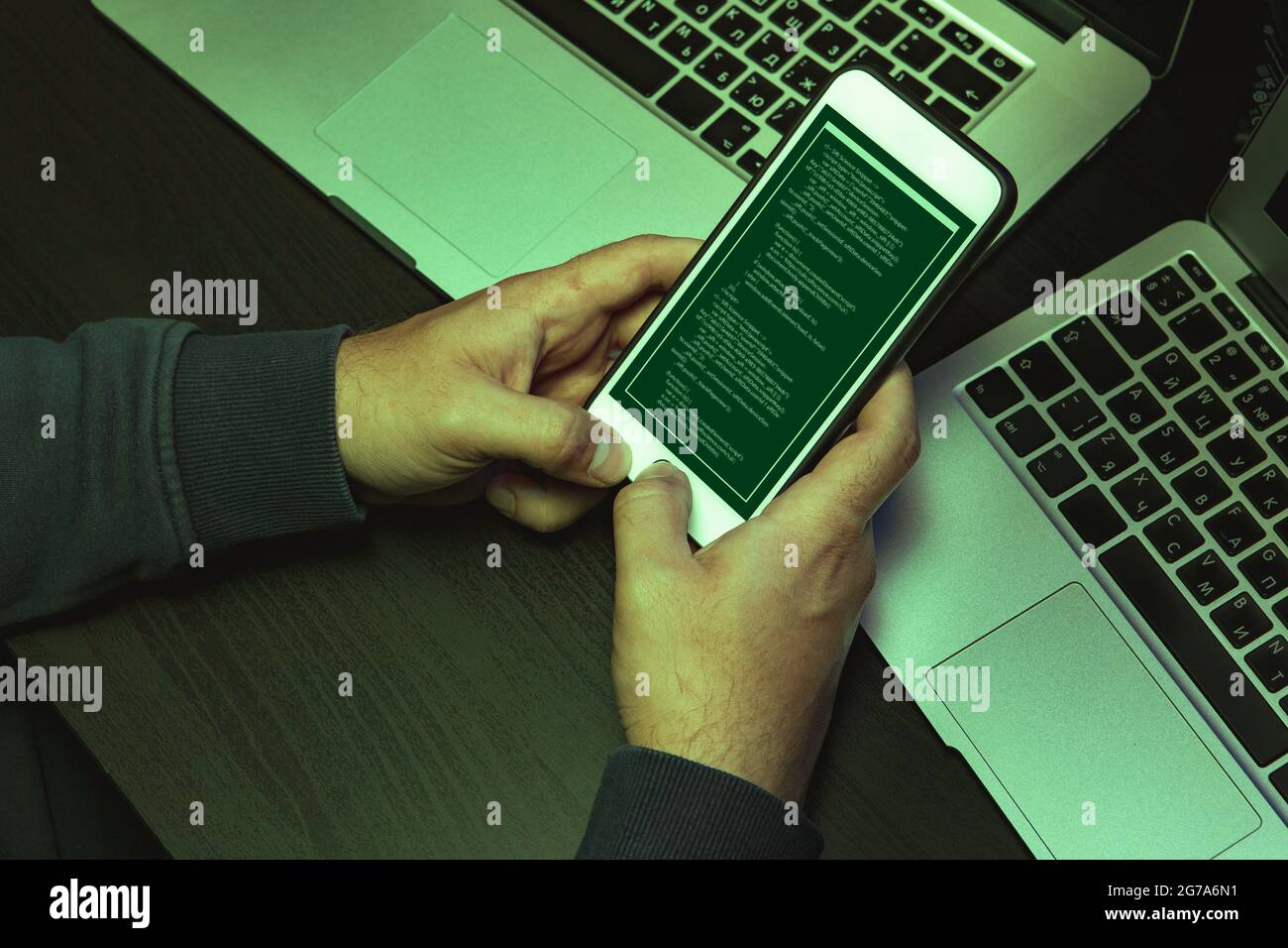 Close up of programmer of hacker hands typing a code Stock Photo - Alamy