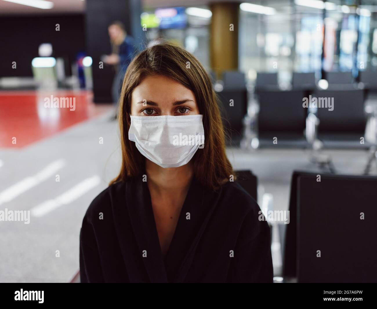 woman medical mask look forward airport waiting Stock Photo - Alamy