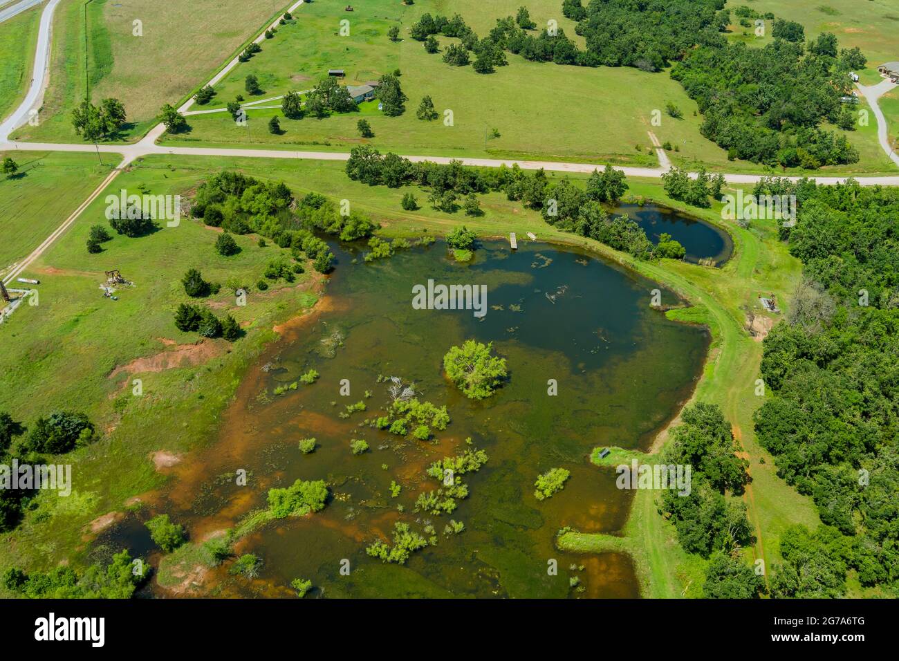 Aerial view beautiful farm fields landscape lake from above from height ...