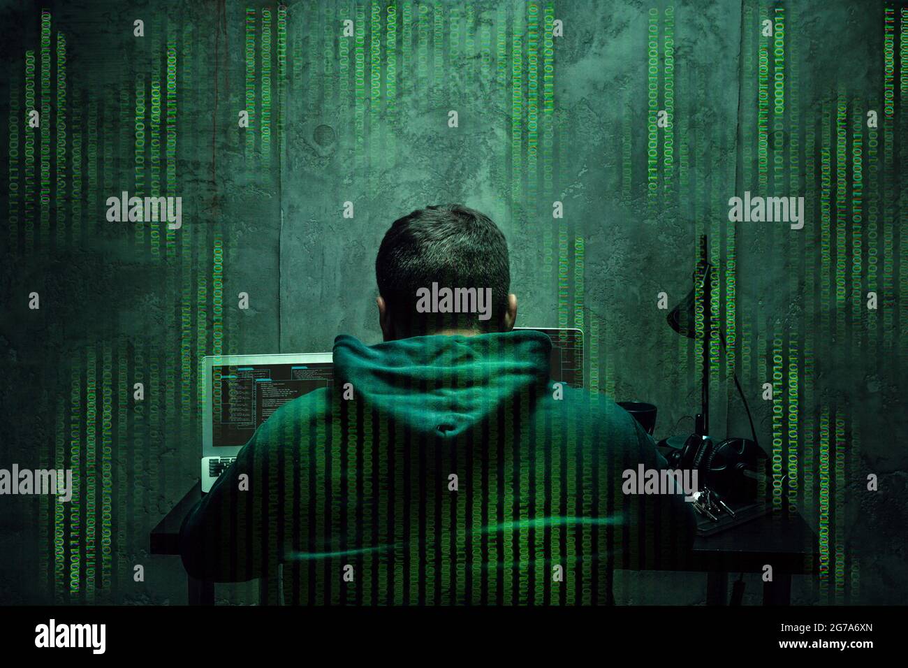 Hacker programmer using computer in dark room Stock Photo - Alamy