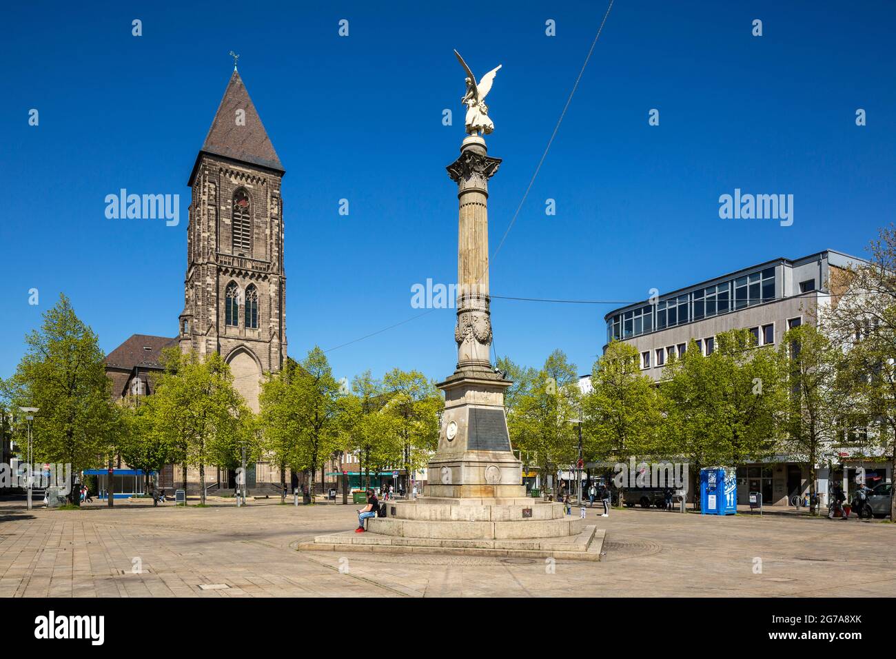 Behind it the catholic parish church herz jesu on marktstrasse hi-res ...