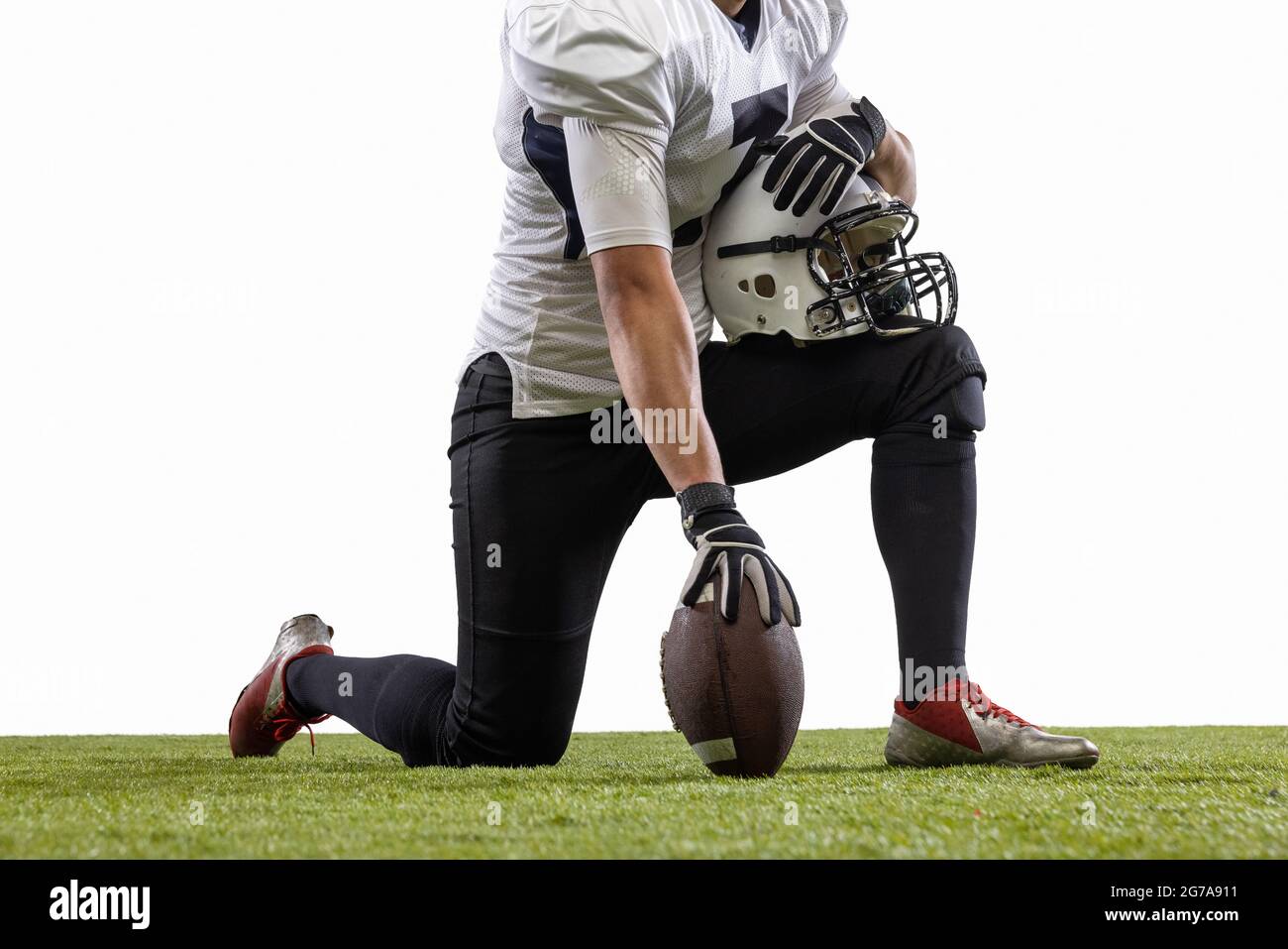 Cropped image of male American football player, athlete posing isolated ...