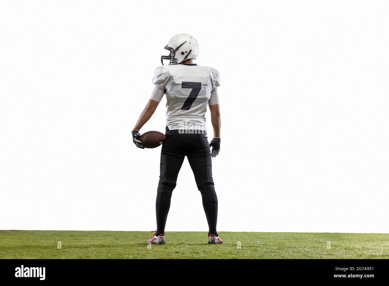 American football player isolated on white studio background. Back view ...